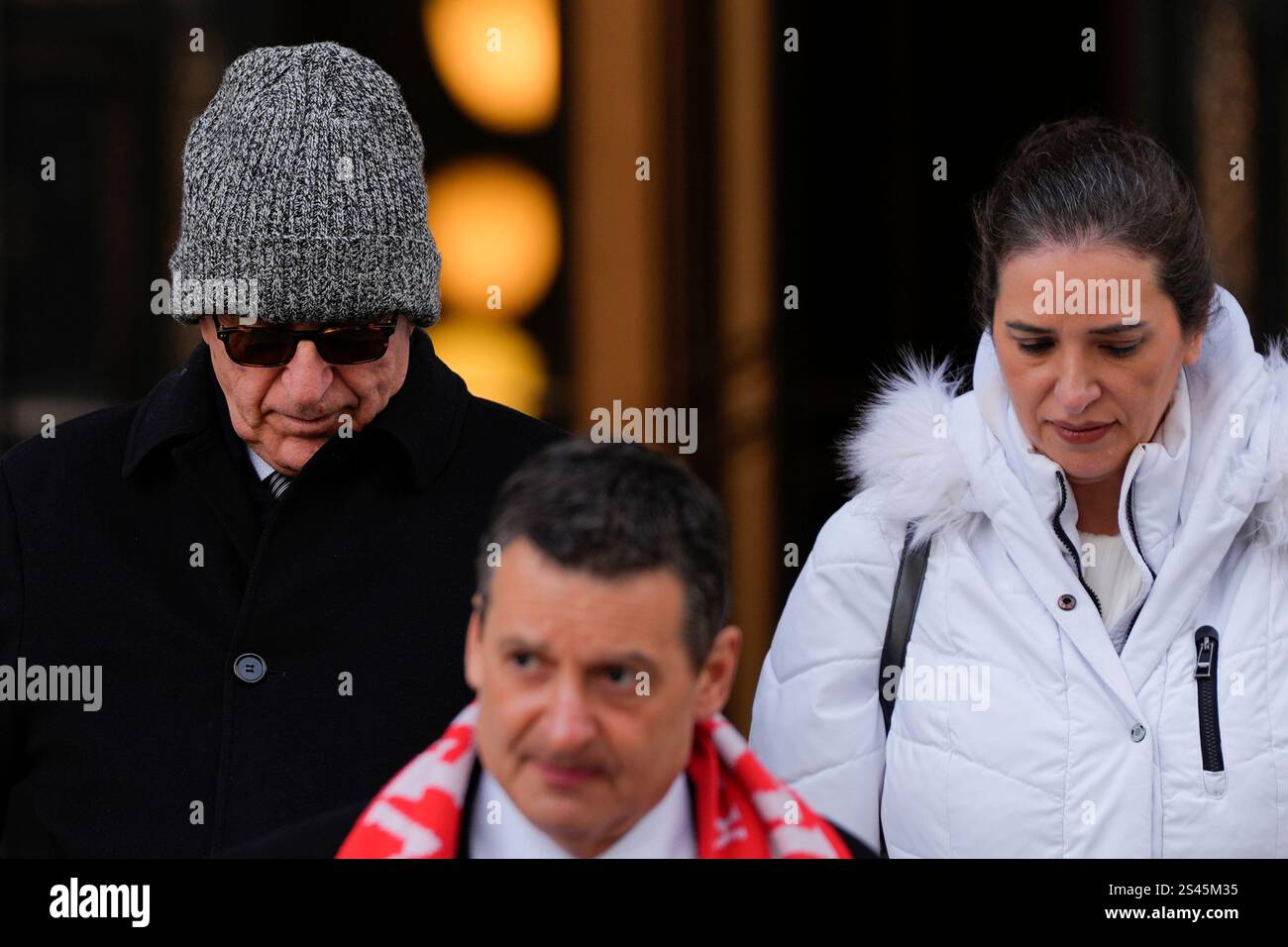 Erden Arkan, left, leaves federal court, Friday, Jan. 10, 2025, in New ...