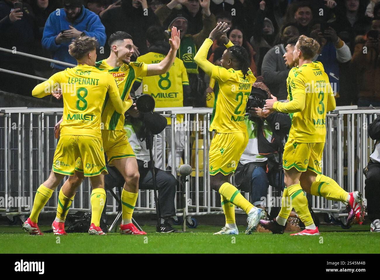 Matthis ABLINE of Nantes celebrate his goal with teammates during the ...