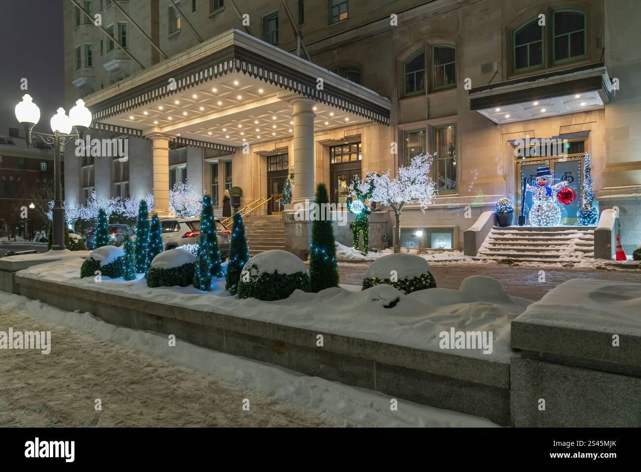 The entrance of The Fort Garry hotel illuminated at night in winter ...