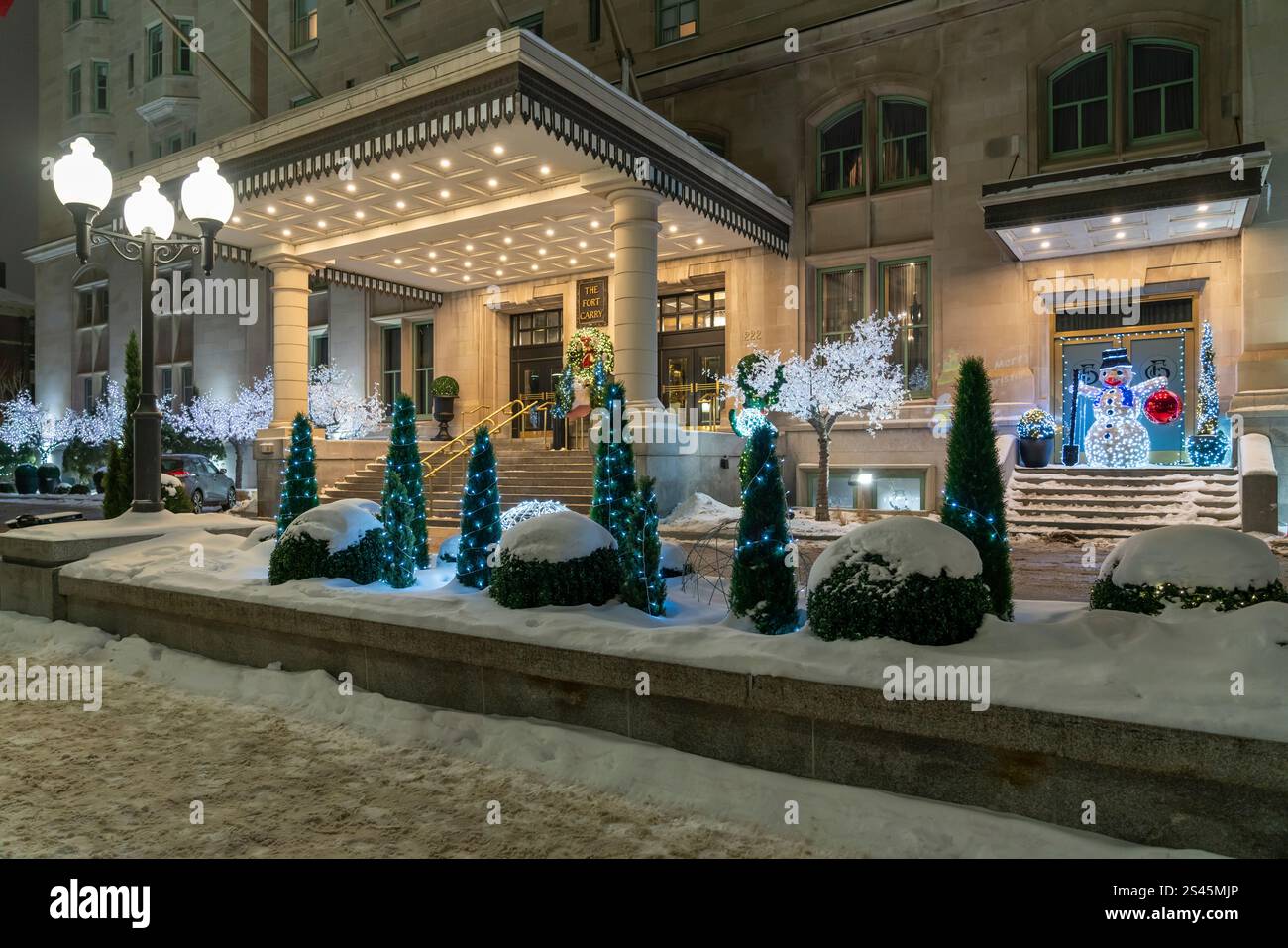 The entrance of The Fort Garry hotel illuminated at night in winter ...
