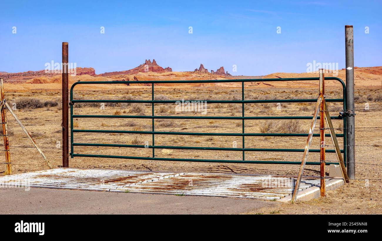 View to red rough rock landscape through texas gate Stock Photo - Alamy