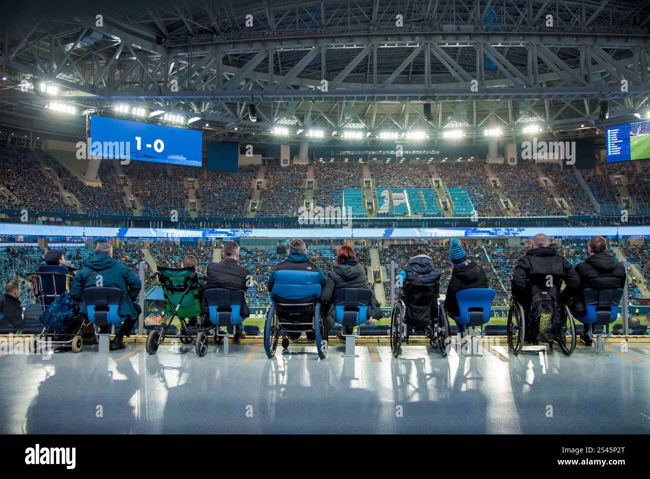 Football match on the soccer field, fans are sitting in the stands ...