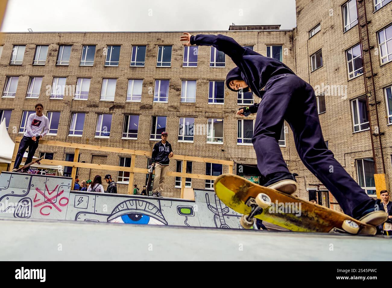 Skateboard contest is an outdoor competition in a skatepark, young ...
