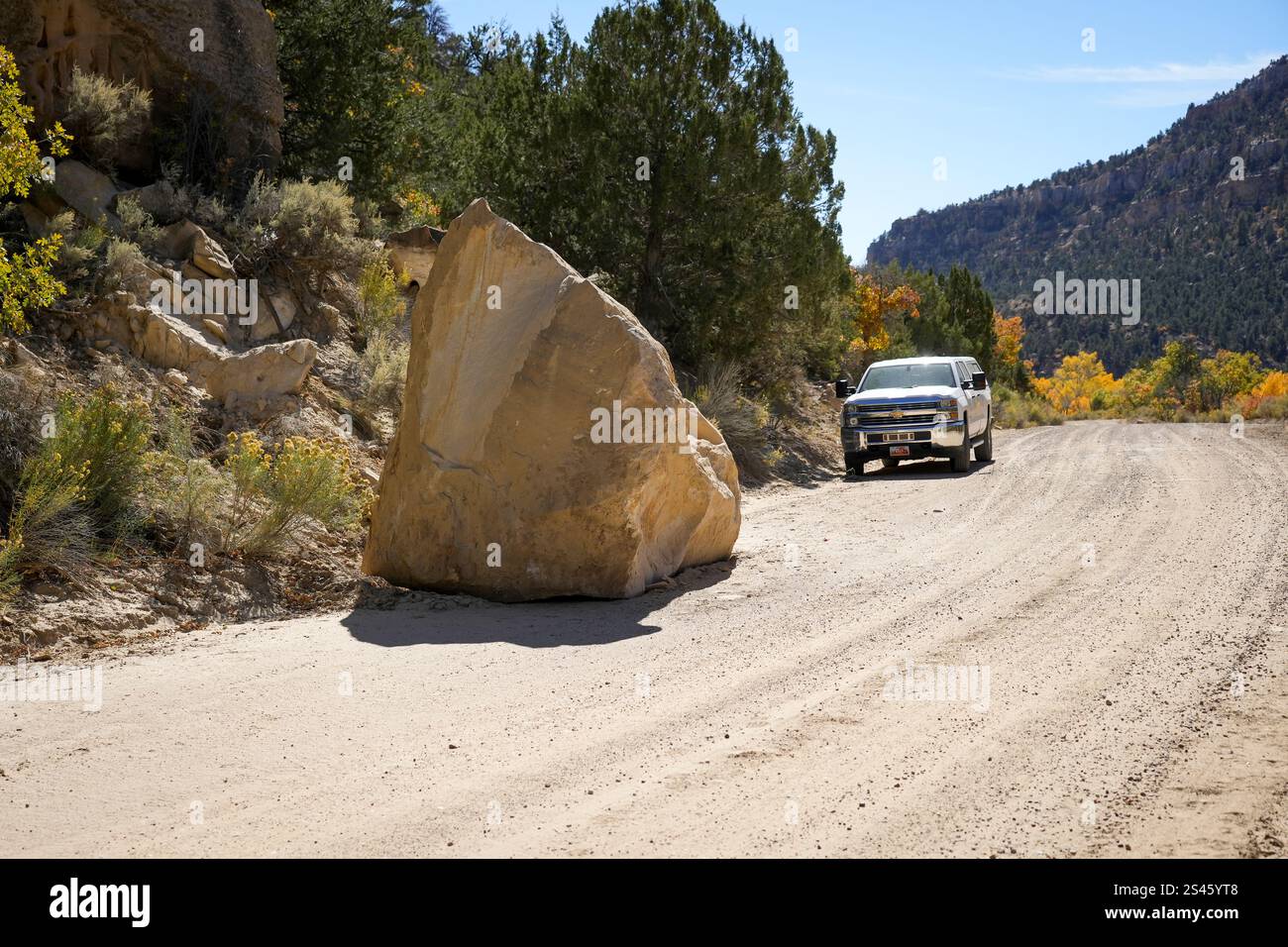 A large rock blocks a section of road in Utah Stock Photo - Alamy