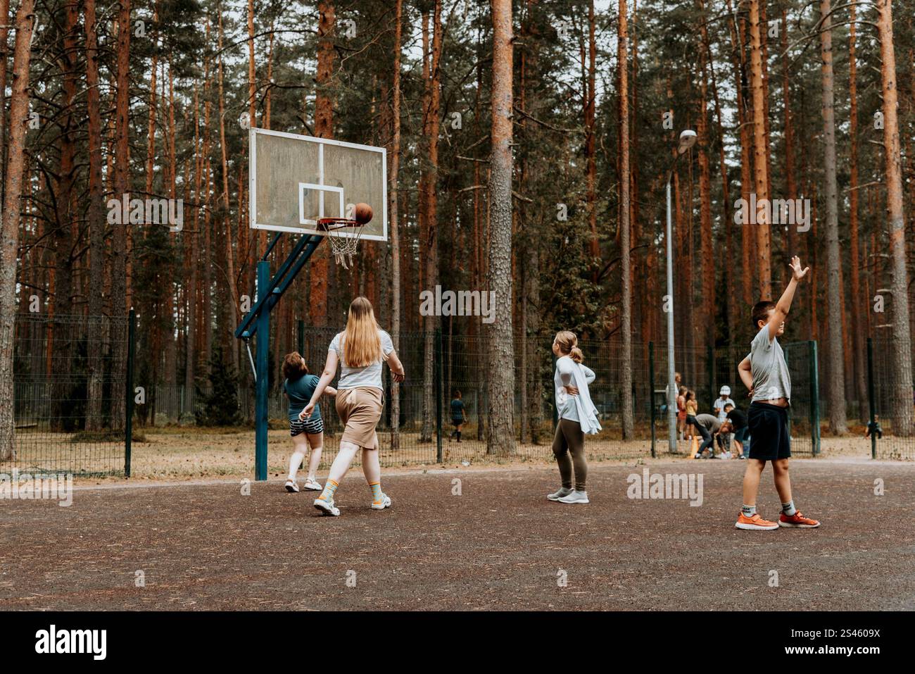 Kids teens playing amateur basketball outdoor summer sport Stock Photo ...