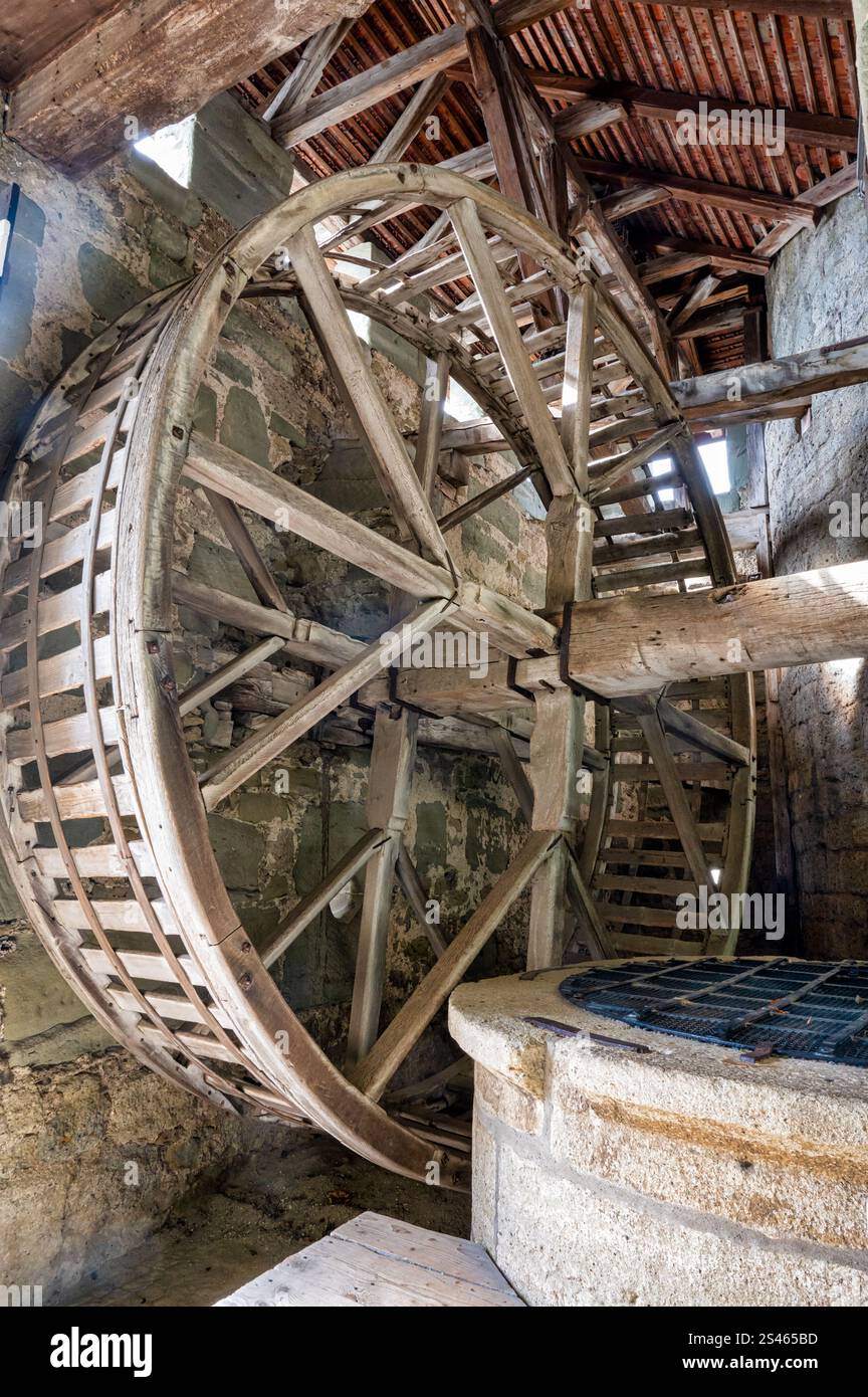 Romont, Switzerland- Sep 24, 2024: A wooden medieval tread wheel used ...