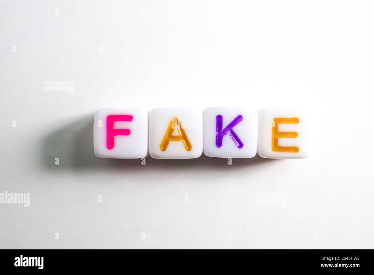 word fake with colorful letters on white background Stock Photo - Alamy