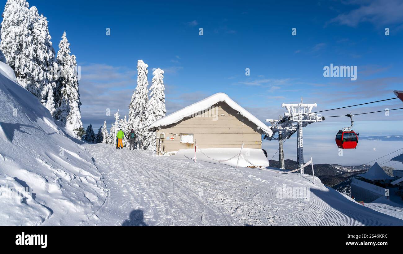 Landscape from top of Postavaru mountain with ski slopes and cable car ...