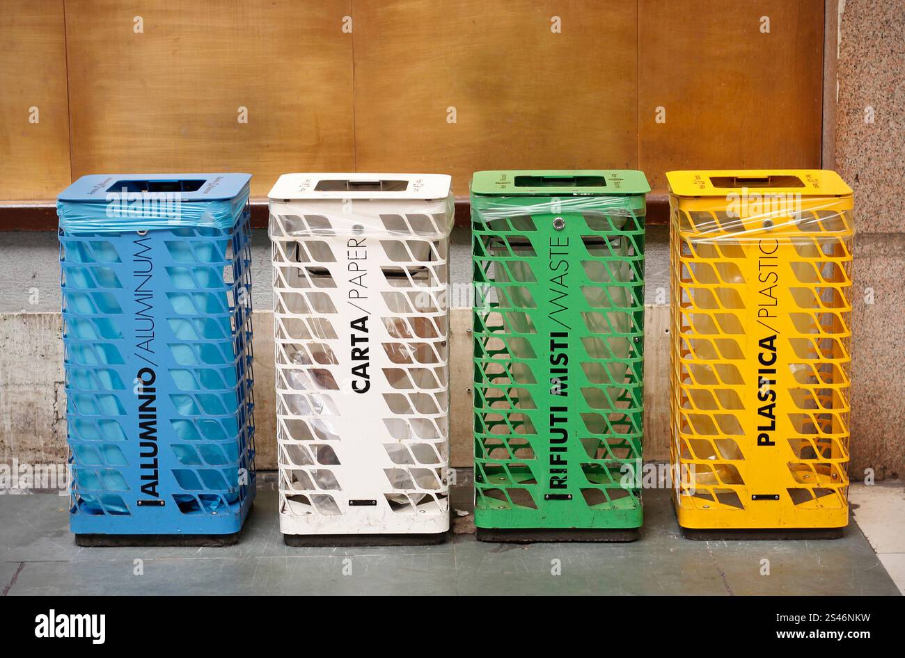 Four colorful recycle trash cans with description in English and ...