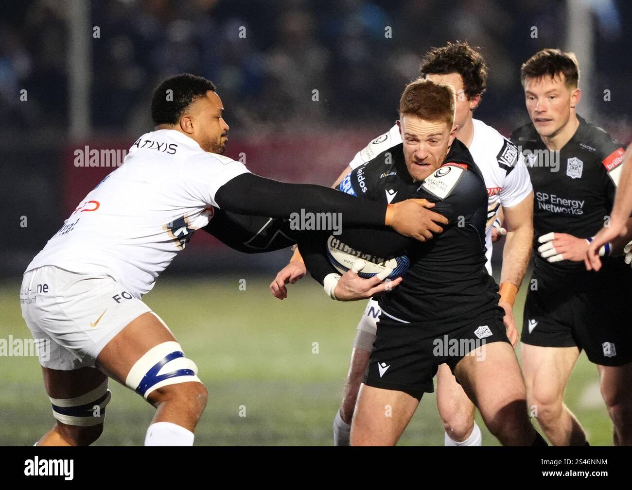 Glasgow Warriors' Kyle Steyn holds off Racing 92's Boris Palu during ...