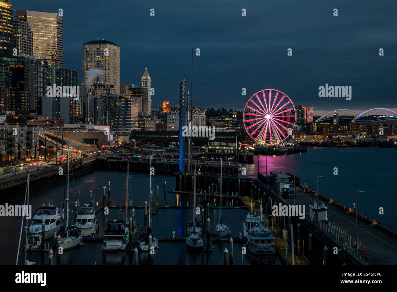 WA28093-00...WASHINGTON - Evening view of the Bell Harbor Marina, the ...