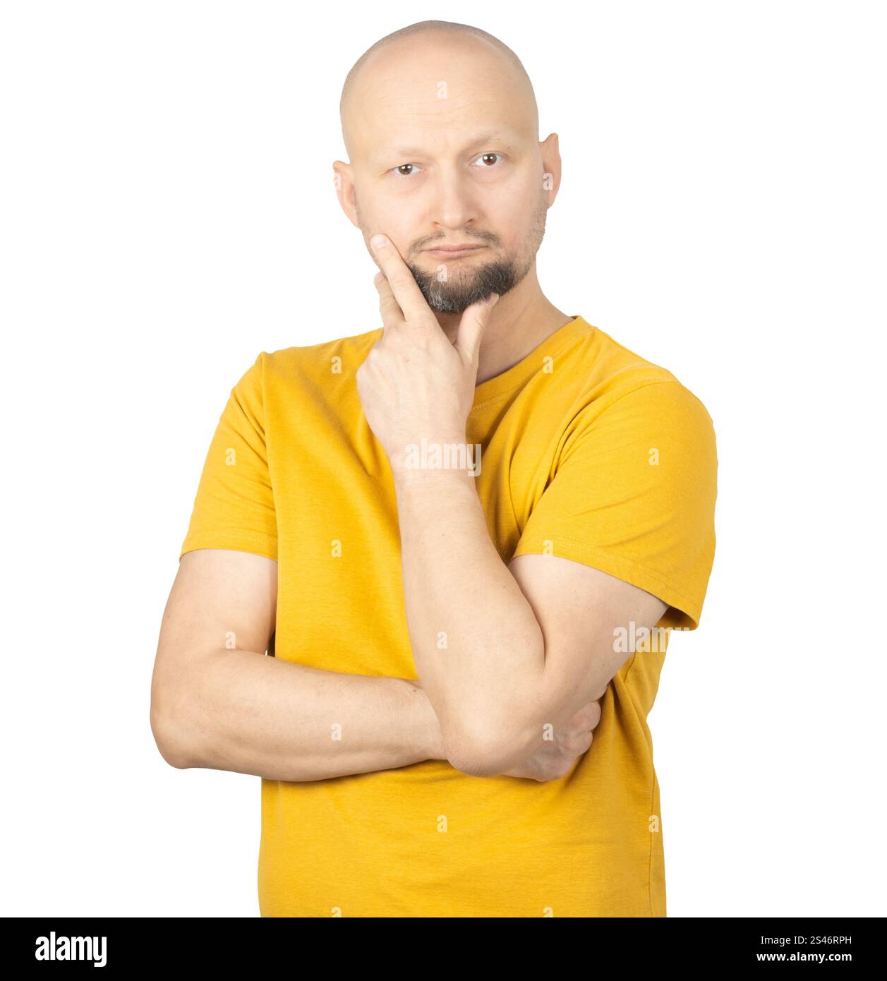 A bald man with a short beard wearing a yellow t-shirt poses against a ...