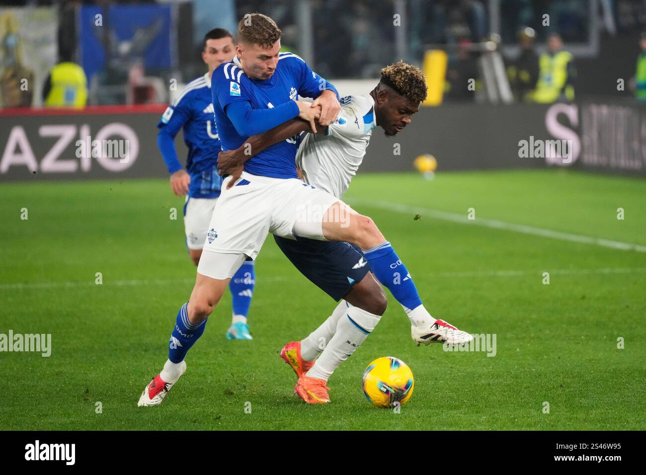 Lazio's Fisayo Dele-Bashiru, right, and Como's Gabriel Strefezza challenge for the ball during ...