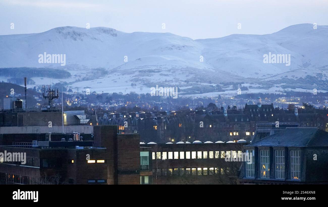 Stunning view of Edinburgh city and snow-covered mountains from ...