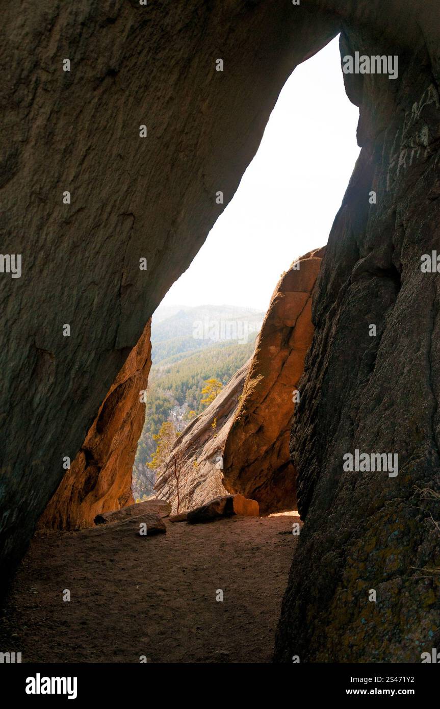Red underground cave, corridor ceiling in the hole of the mountain ...
