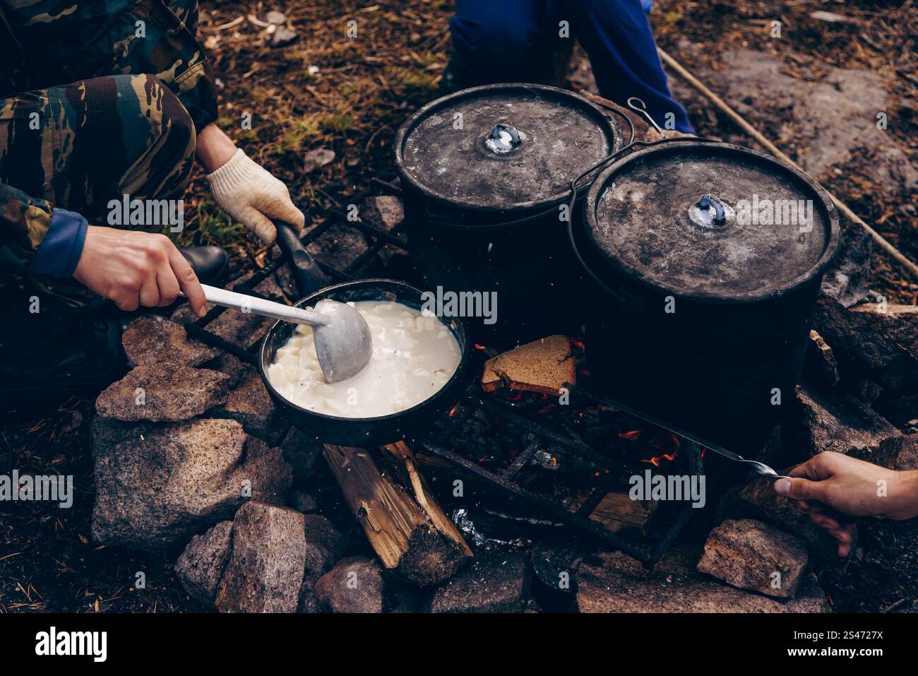 Camping Camp Kitchen, Travelers Cooking Food in Pots on a Campfire ...