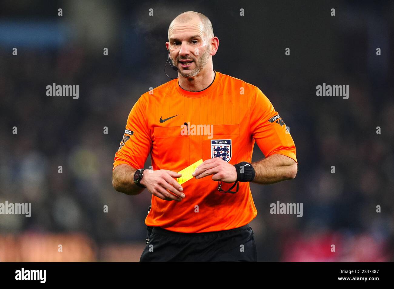 Referee Tim Robinson before showing a yellow card to West Ham United's ...