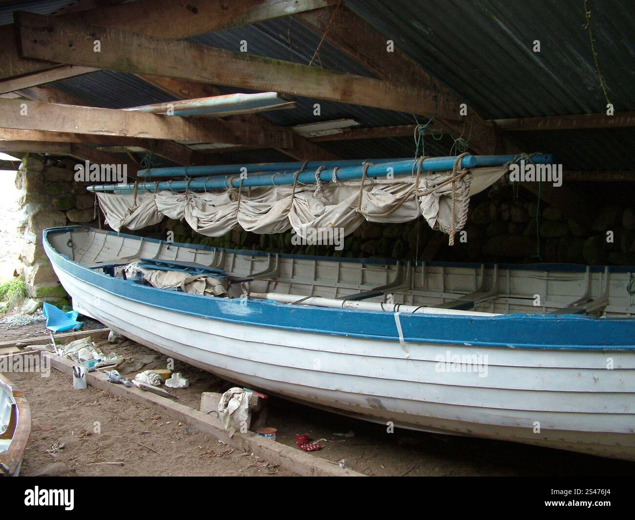 Pilot Gig in a shed on St Agnes, Isles of Scilly, with its mast and ...