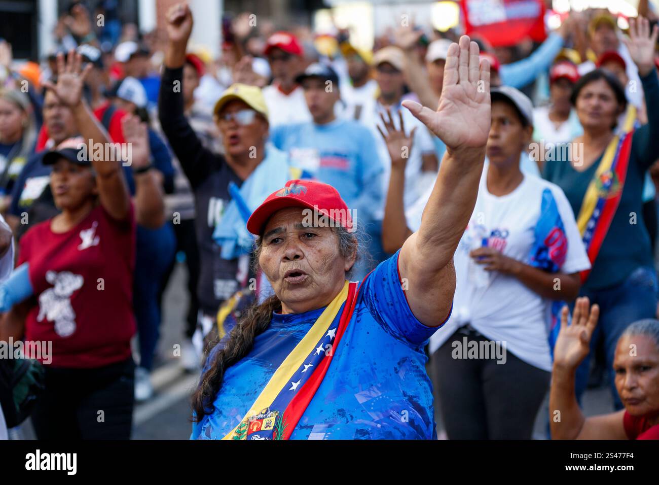 Government supporters listen to President Nicolas Maduro speaking on ...