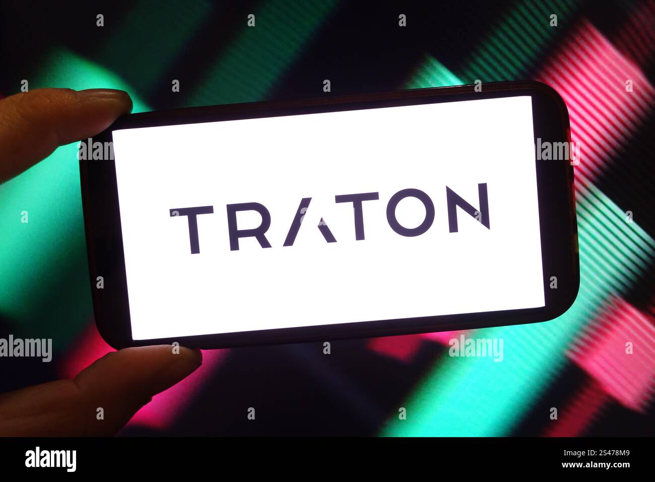 In this photo illustration, the Traton company logo is seen displayed ...