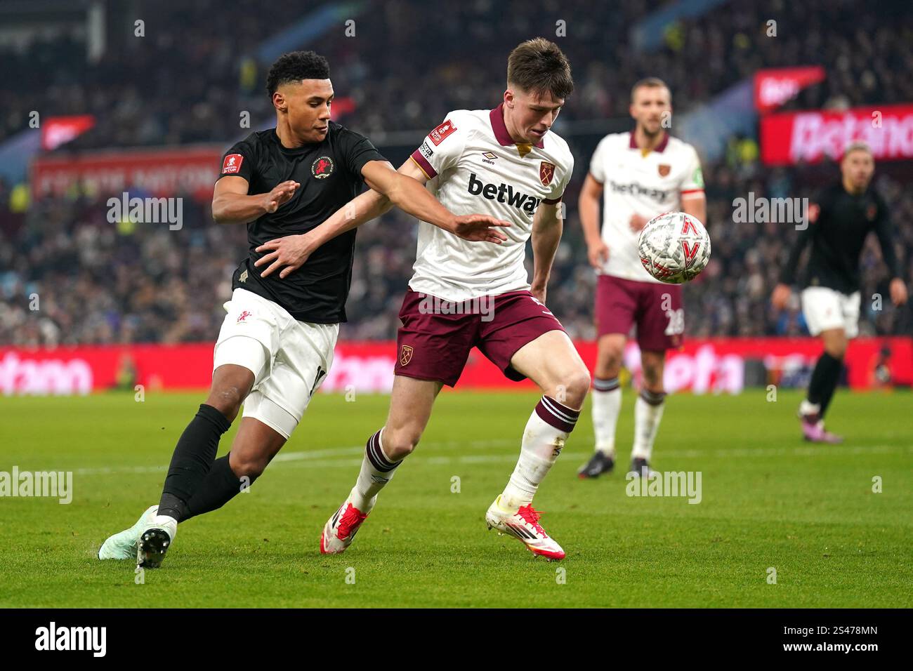 Aston Villa's Ollie Watkins (left) and West Ham United's Oliver Scarles ...