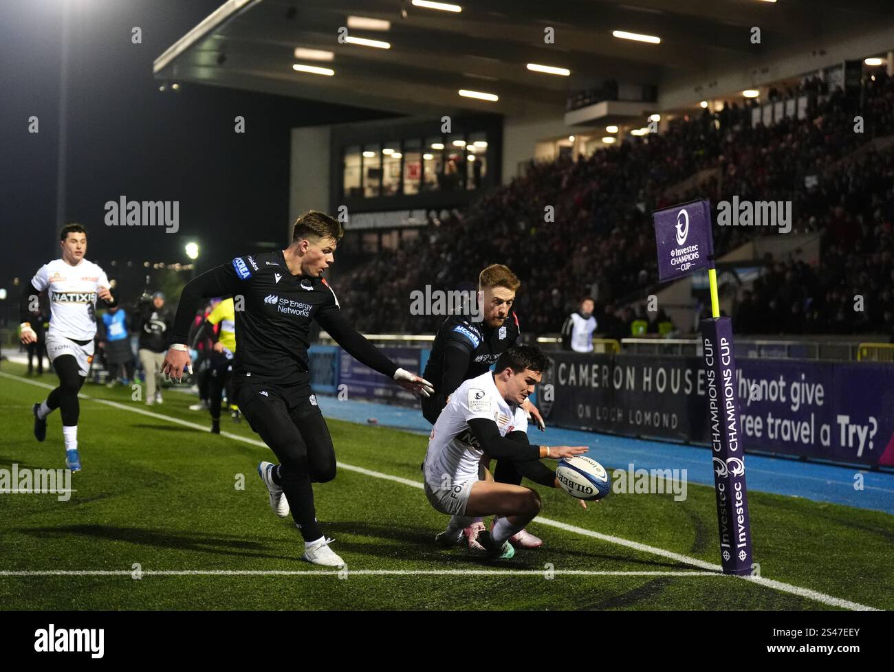Glasgow Warriors' Kyle Steyn defends from Racing 92's Max Spring during ...