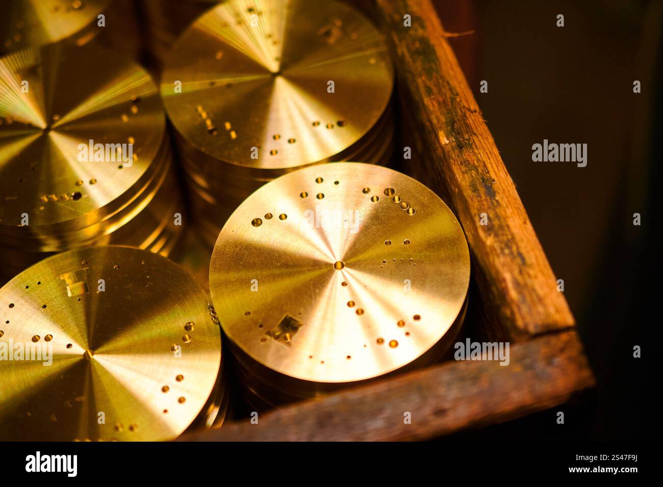 Watch mechanism bases reveal intricate metalworking techniques in a ...