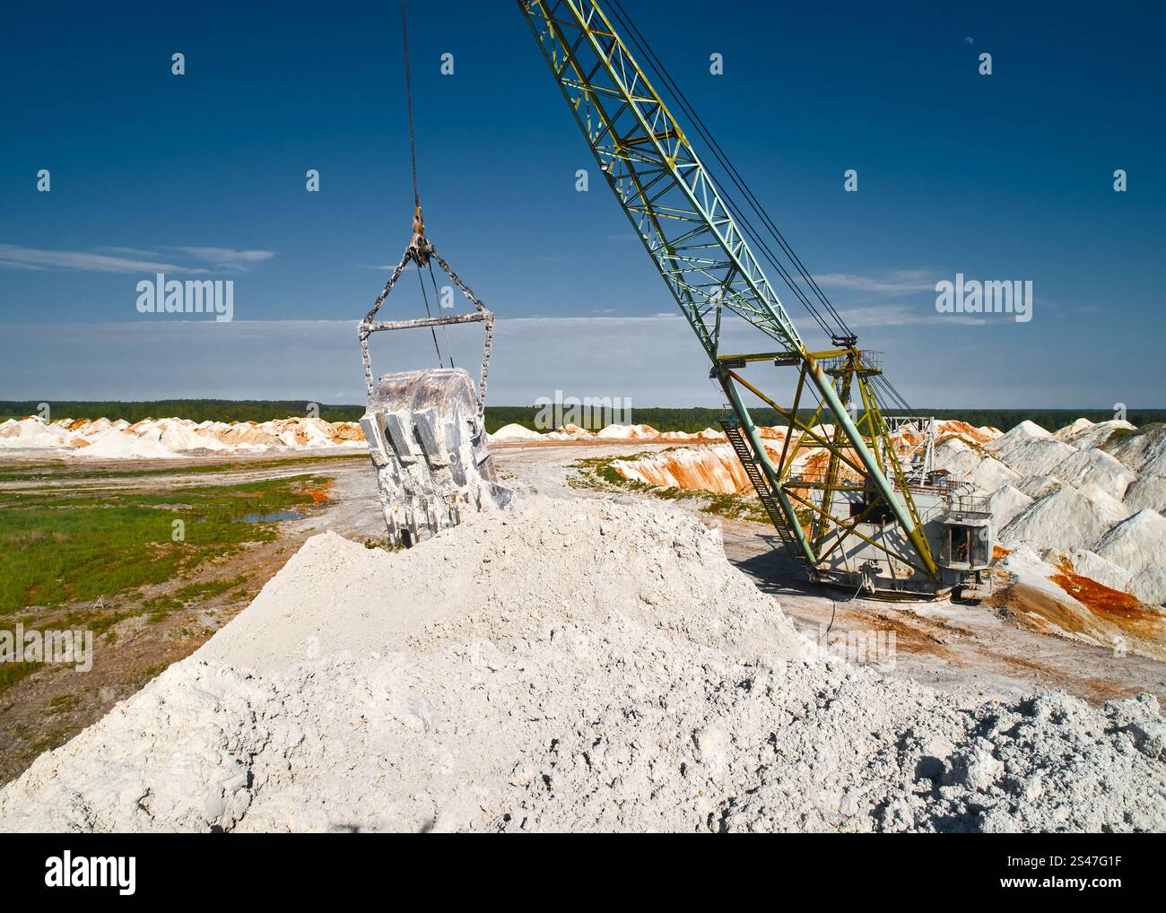 Walking dragline with limestone in bucket at chalkquarry Stock Photo ...