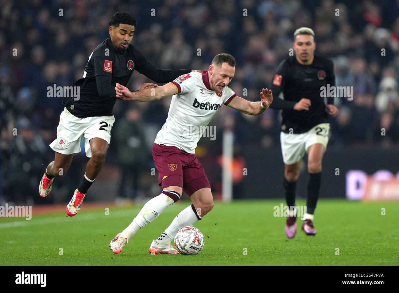 Aston Villa's Ian Maatsen (left) challenges West Ham United's Vladimir Coufal during the ...