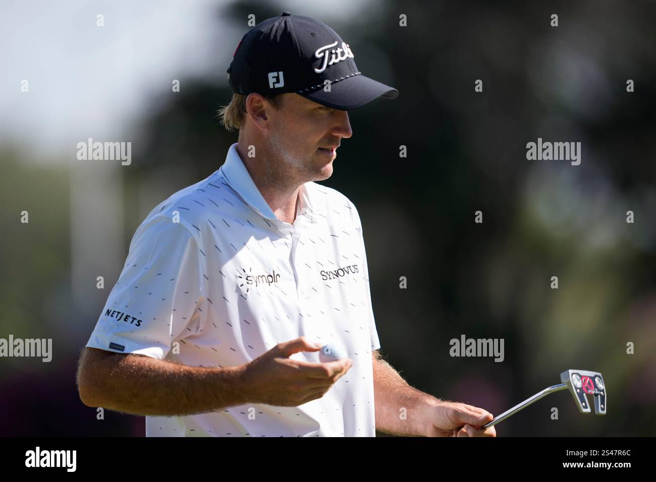 Russell Henley reacts after making a shot on the fifth green during the ...