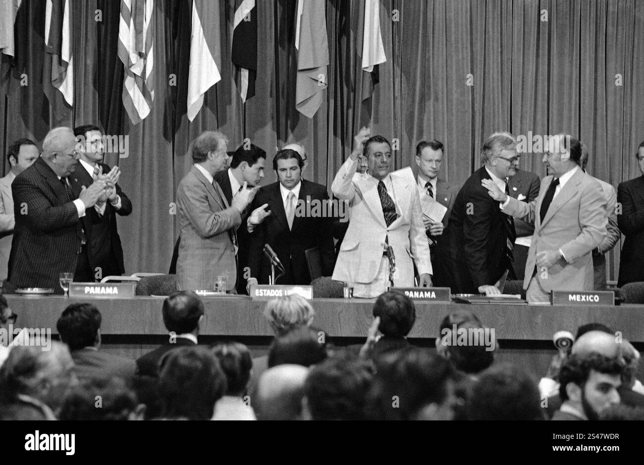 FILE - President Jimmy Carter applauds and General Omar Torrijos waves ...