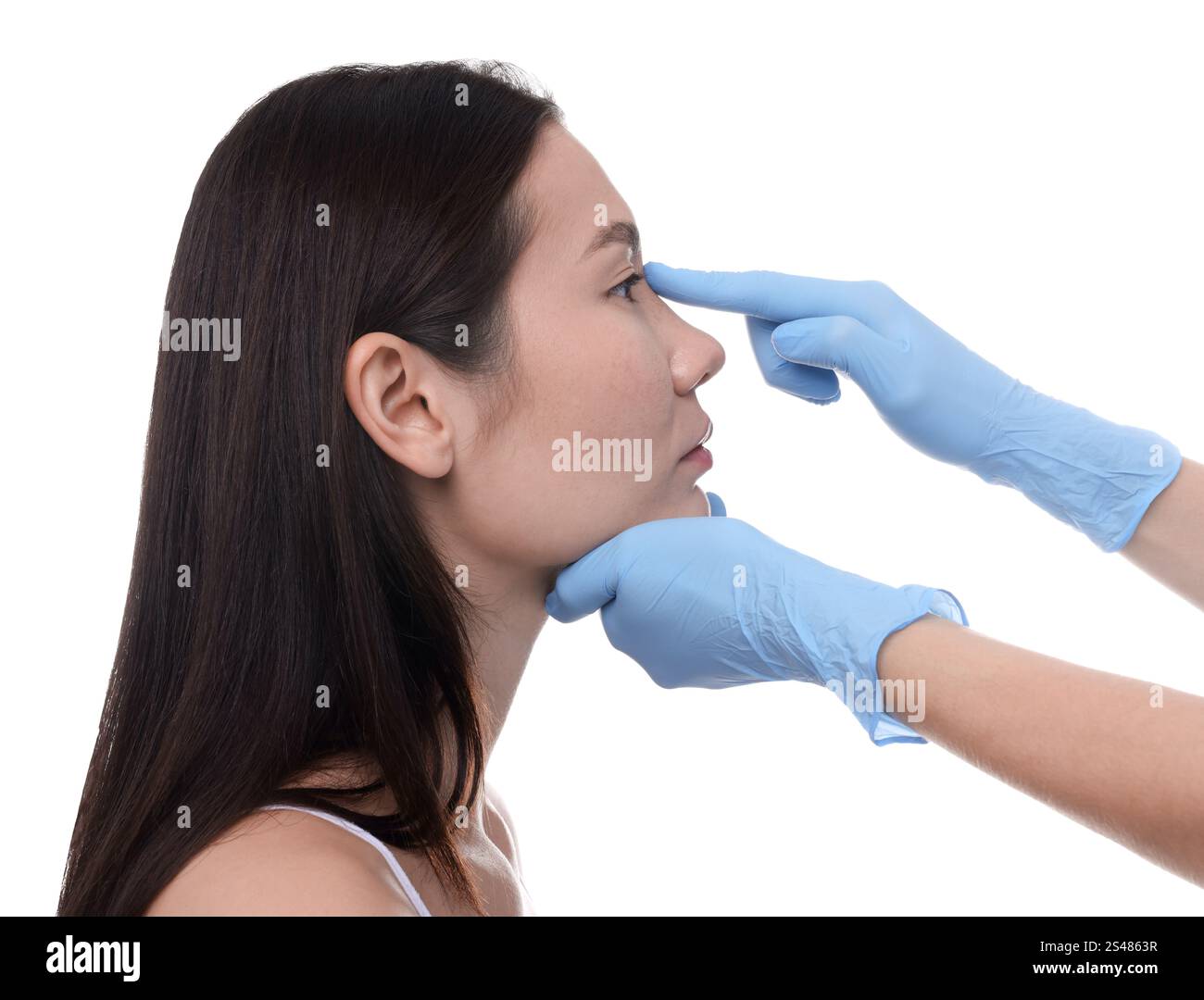 Doctor checking patient's nose before plastic surgery operation on ...