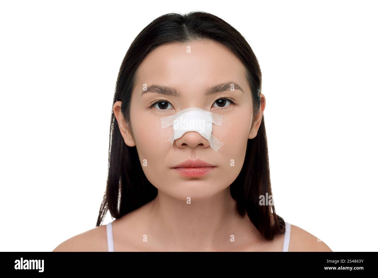 Woman with medical bandage on her nose after plastic surgery operation ...