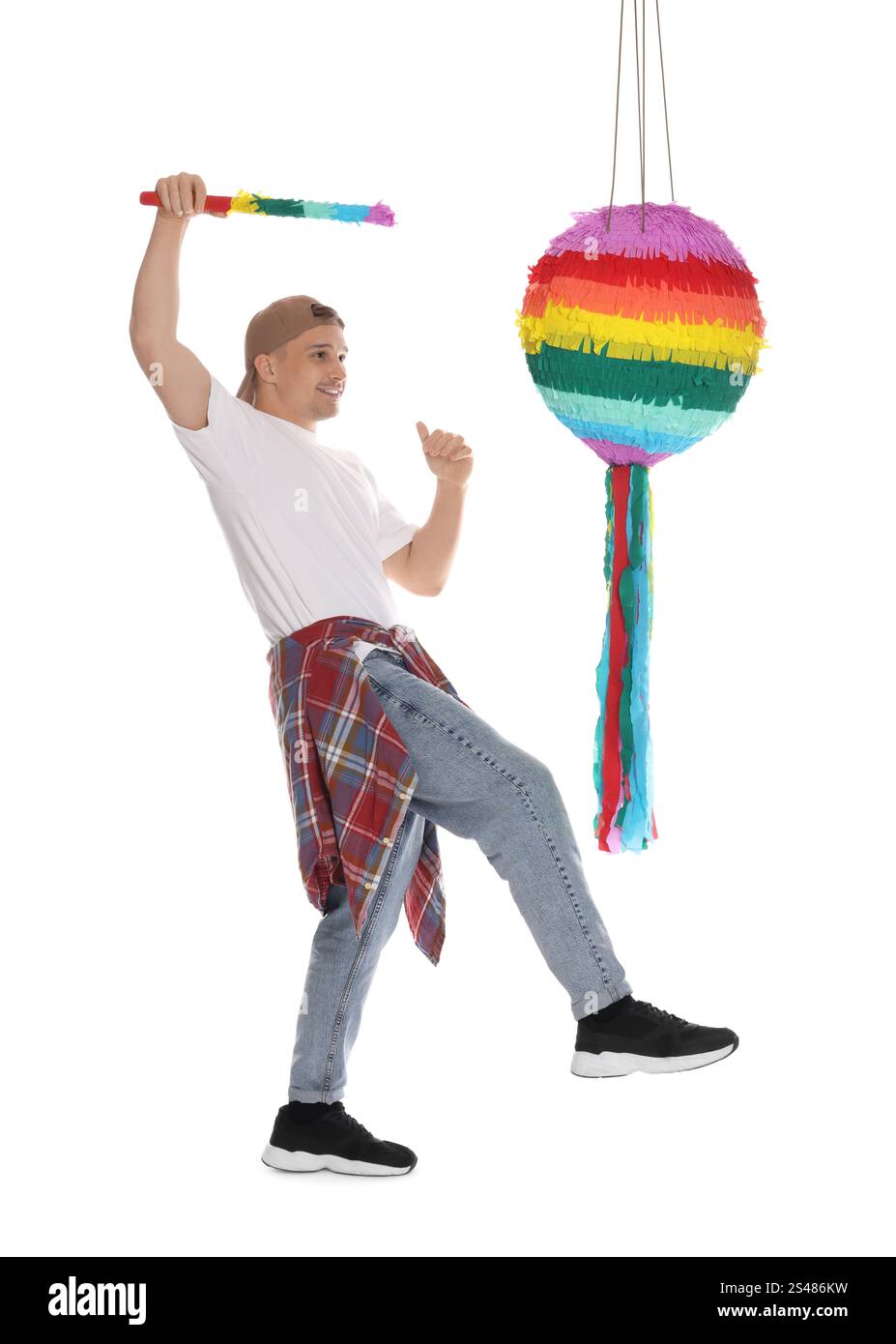 Happy man breaking pinata on white background Stock Photo - Alamy