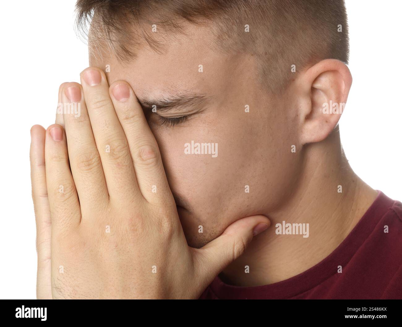 Distressed young man crying on white background Stock Photo - Alamy