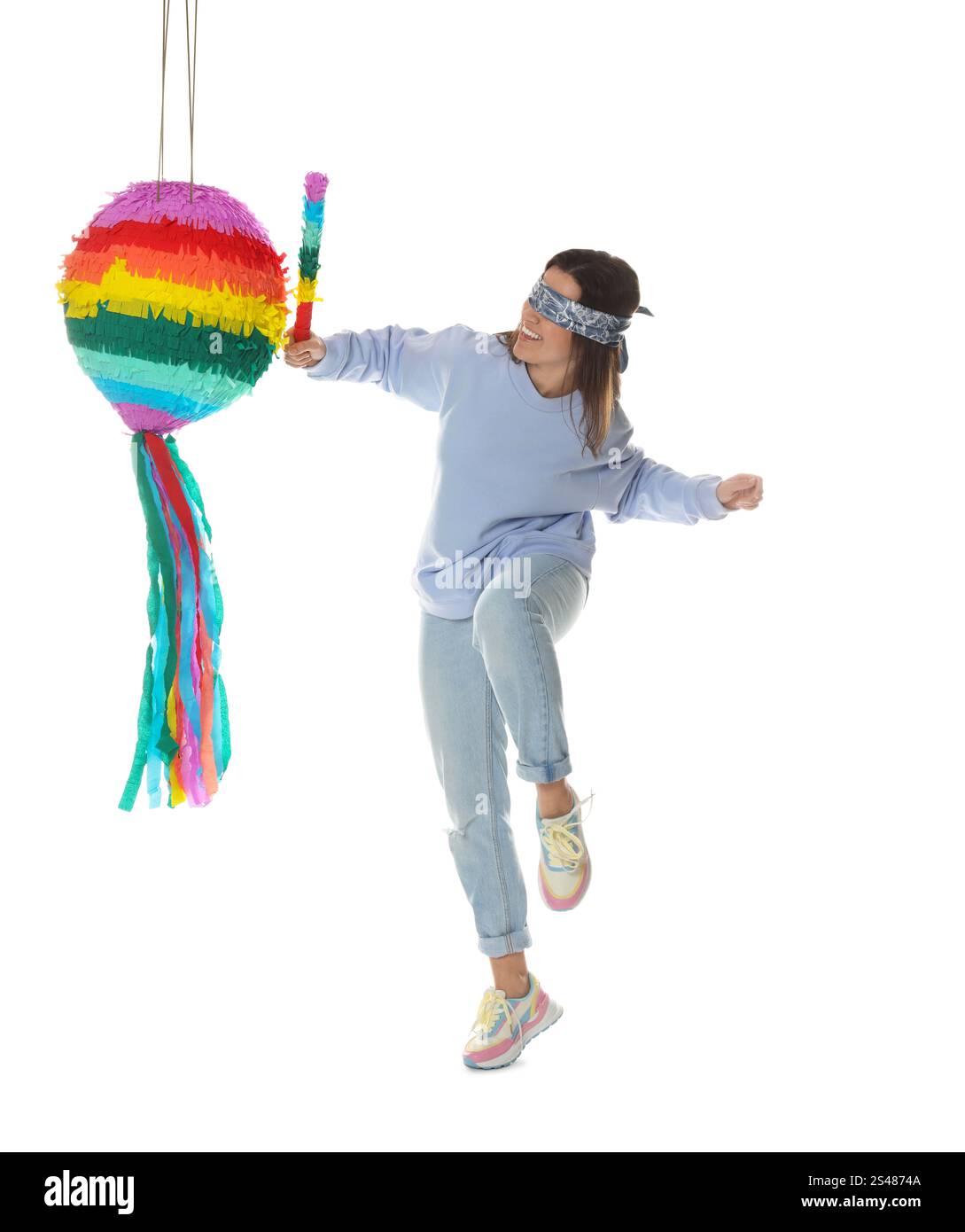 Woman with tied eyes breaking pinata on white background Stock Photo ...