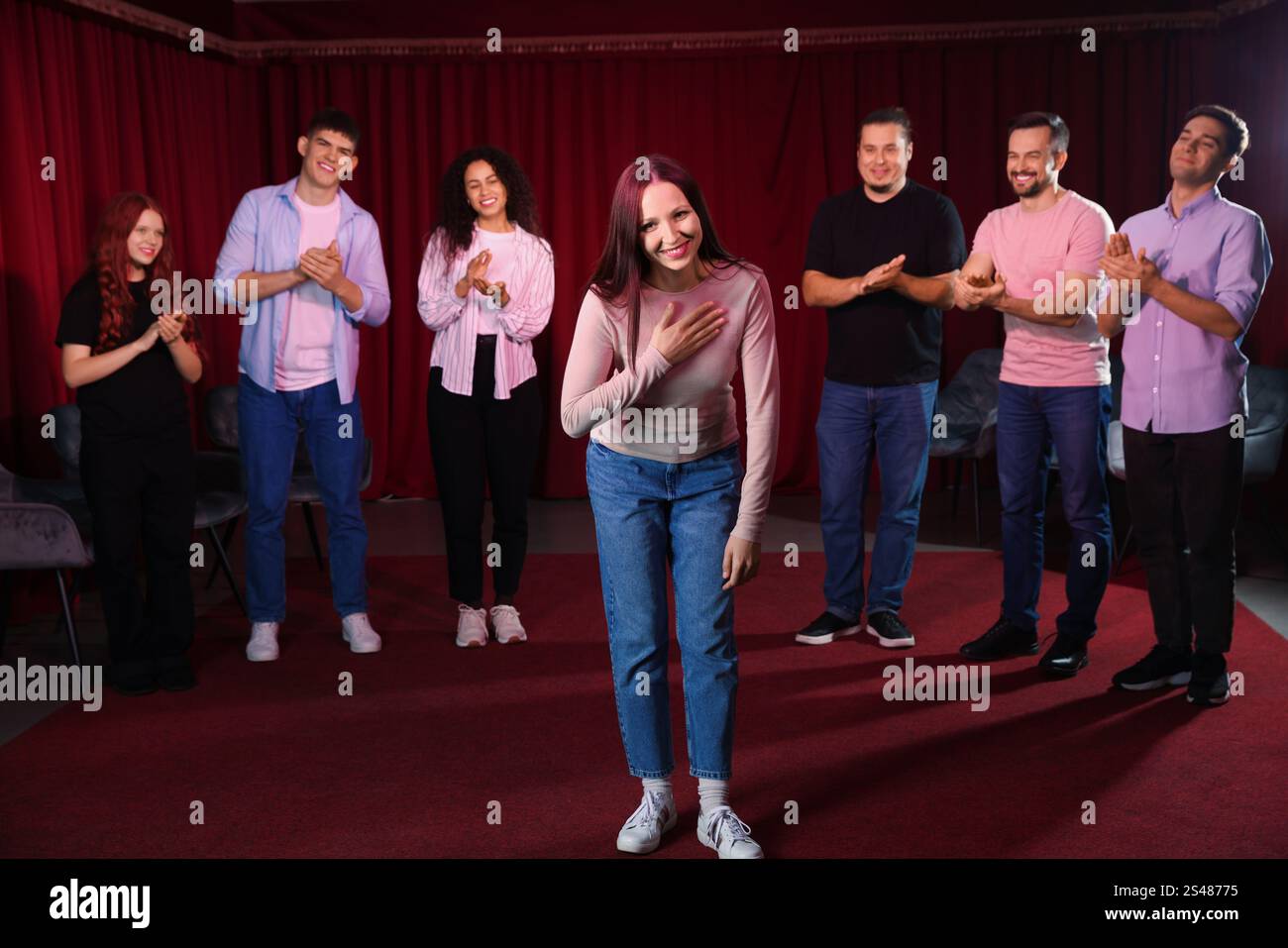 Professional actors bowing on stage in theatre Stock Photo - Alamy