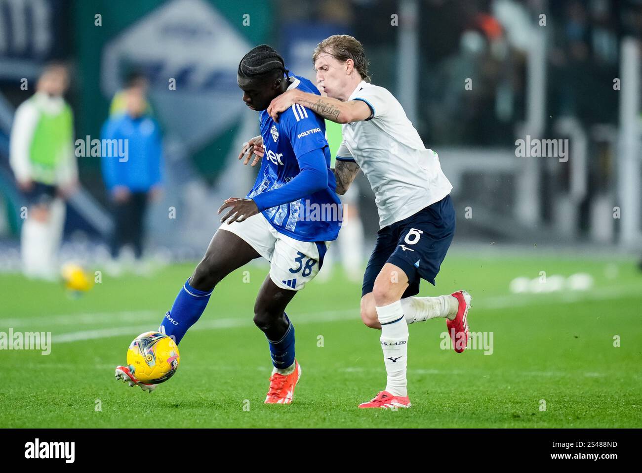 Rome, Italy. 10th Jan, 2025. Assane Diao of Como 1907 and Nicolo' Rovella of SS Lazio compete ...
