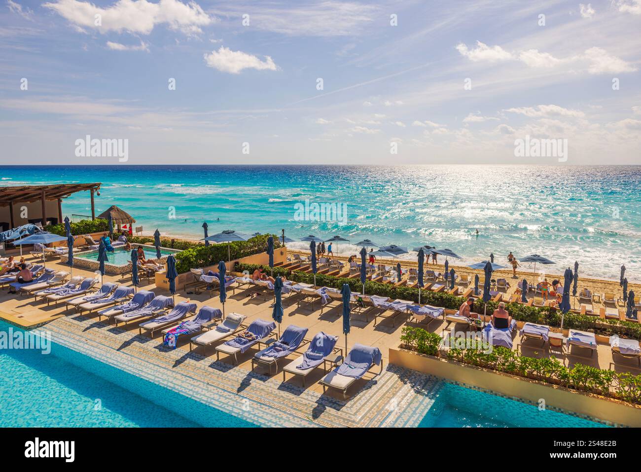 Resort poolside view overlooking Caribbean beach with turquoise water ...