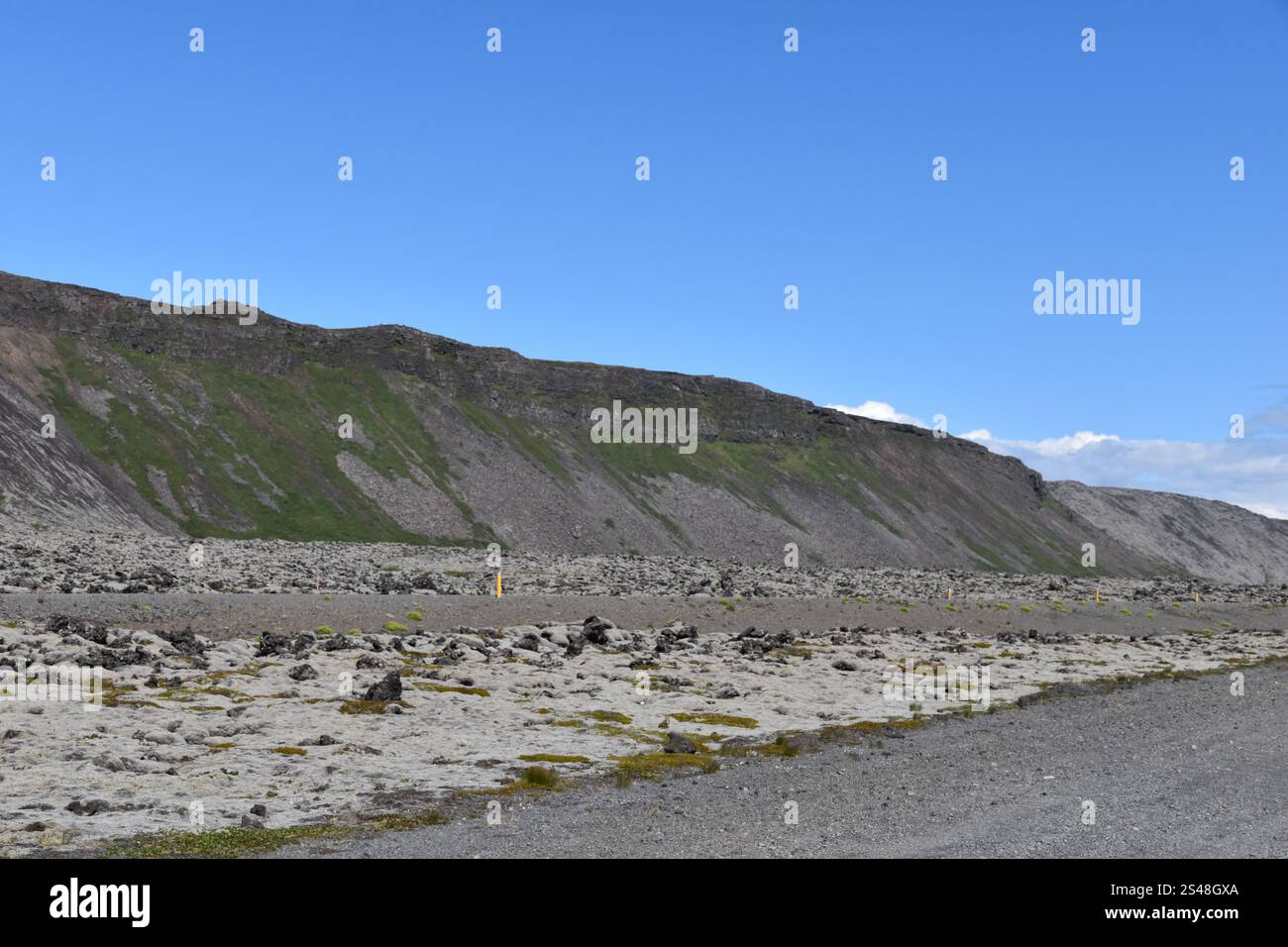 South Coast Iceland landscape by ocean with lava rock covered in white ...