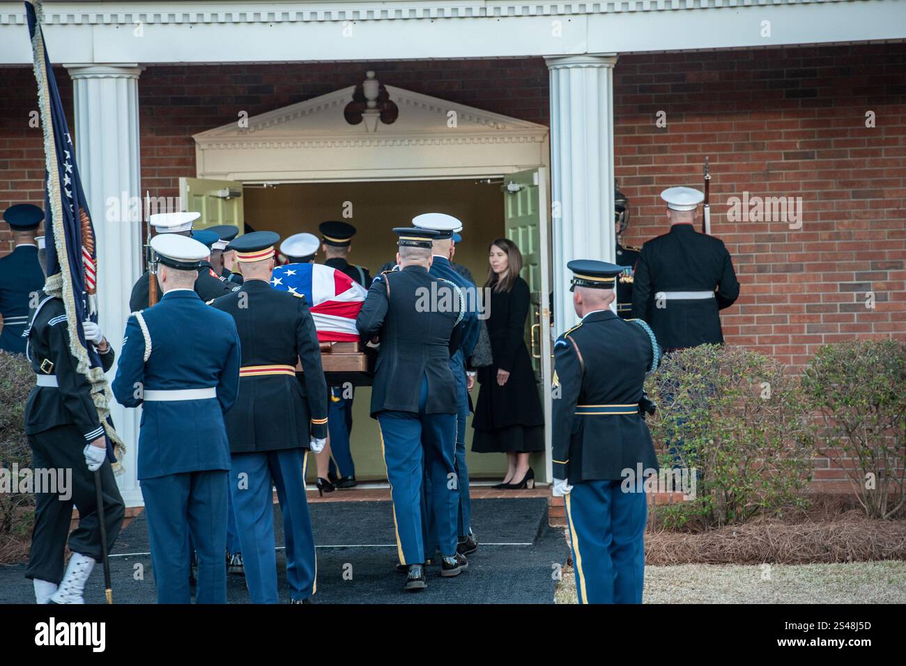United States service members carrying the casket of former US ...
