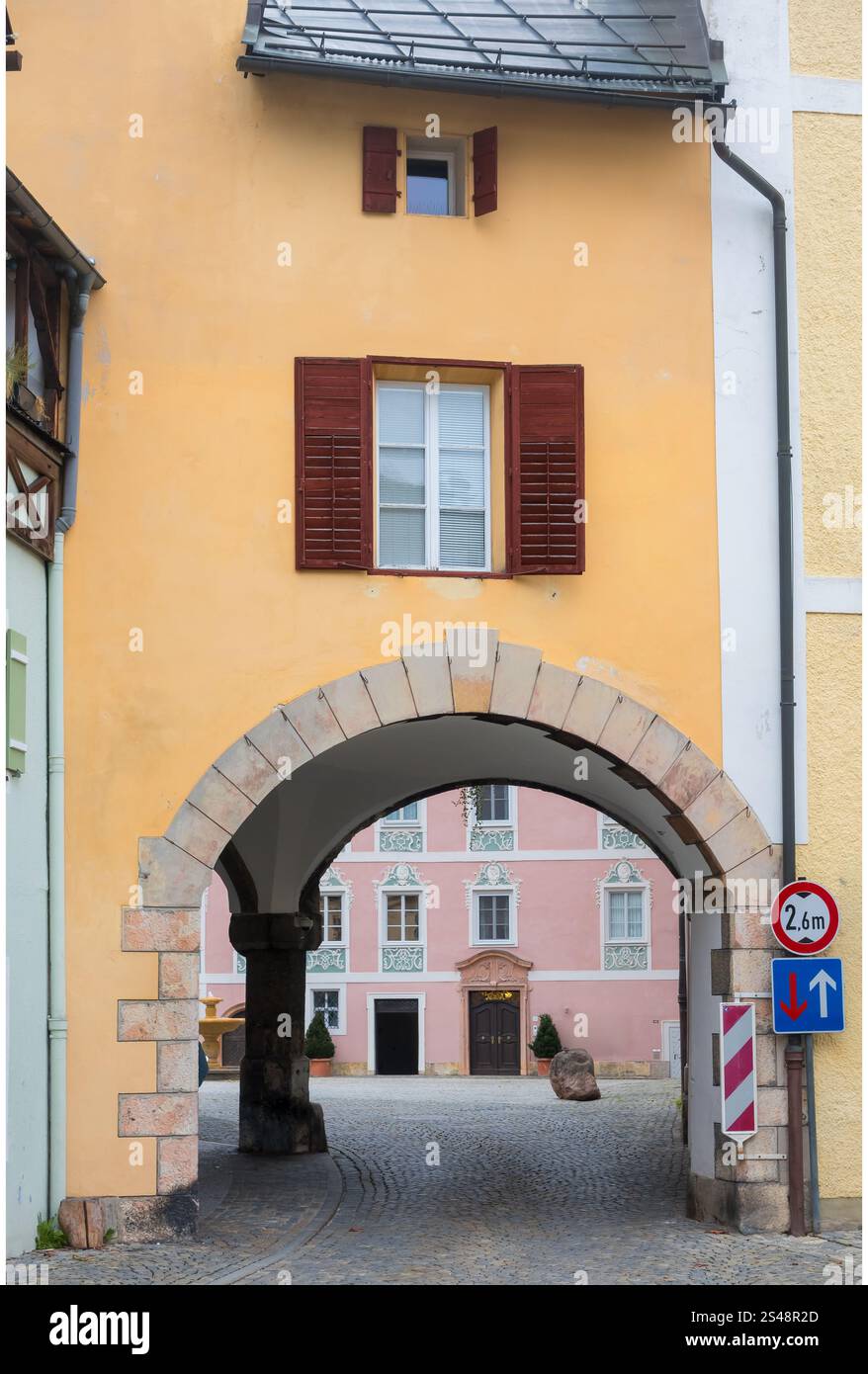 Historic yellow color building with Arch way in Berchtesgaden, Bavaria ...