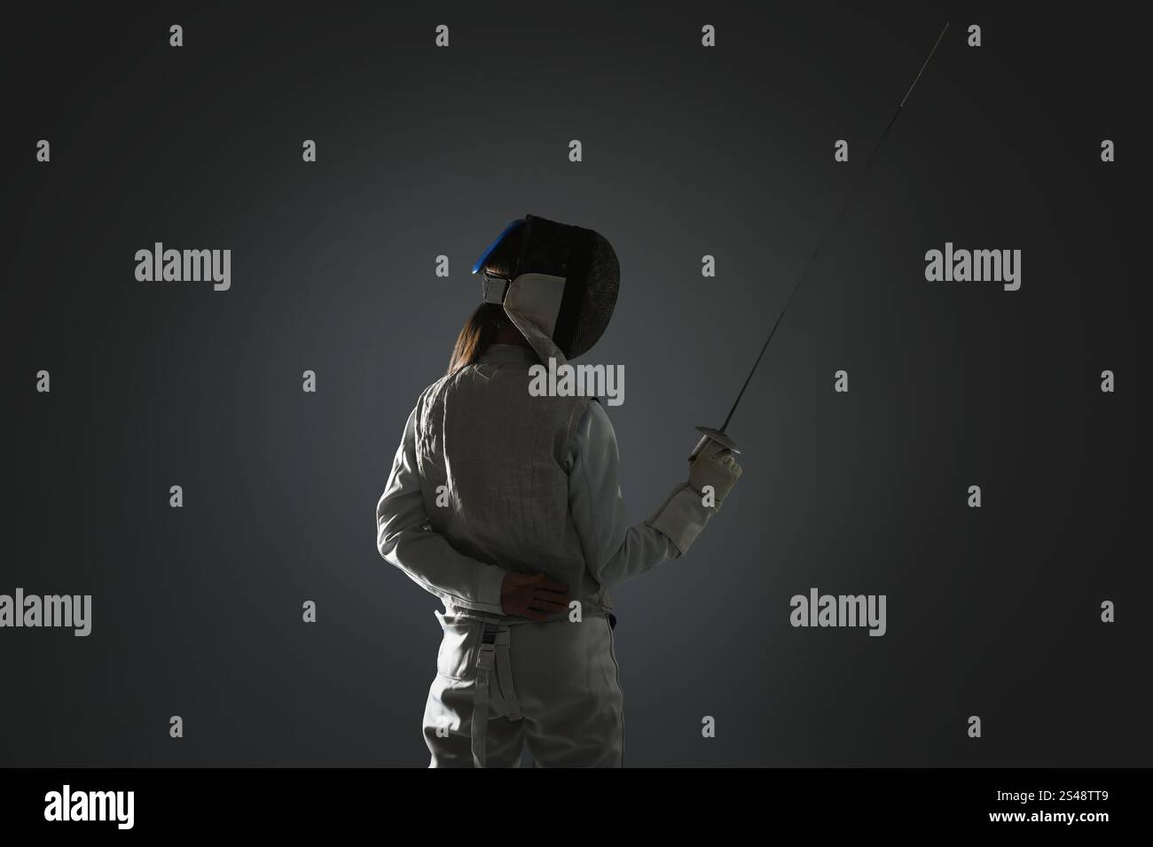 Fencer with epee on gray background. Combat sport Stock Photo - Alamy