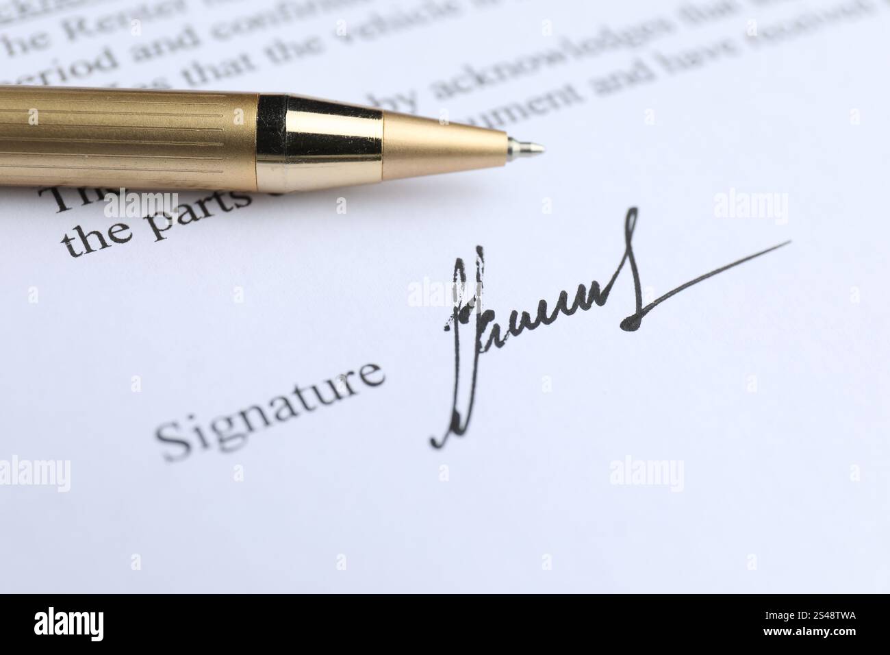 Ballpoint pen and signature on contract, closeup Stock Photo - Alamy
