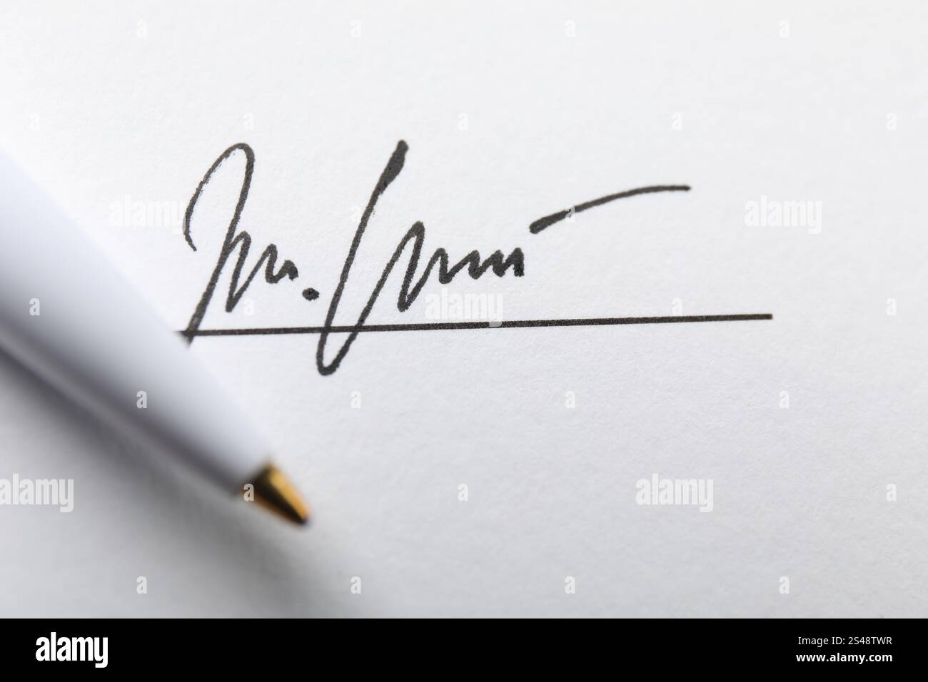 Signature and pen on paperwork, closeup view Stock Photo - Alamy