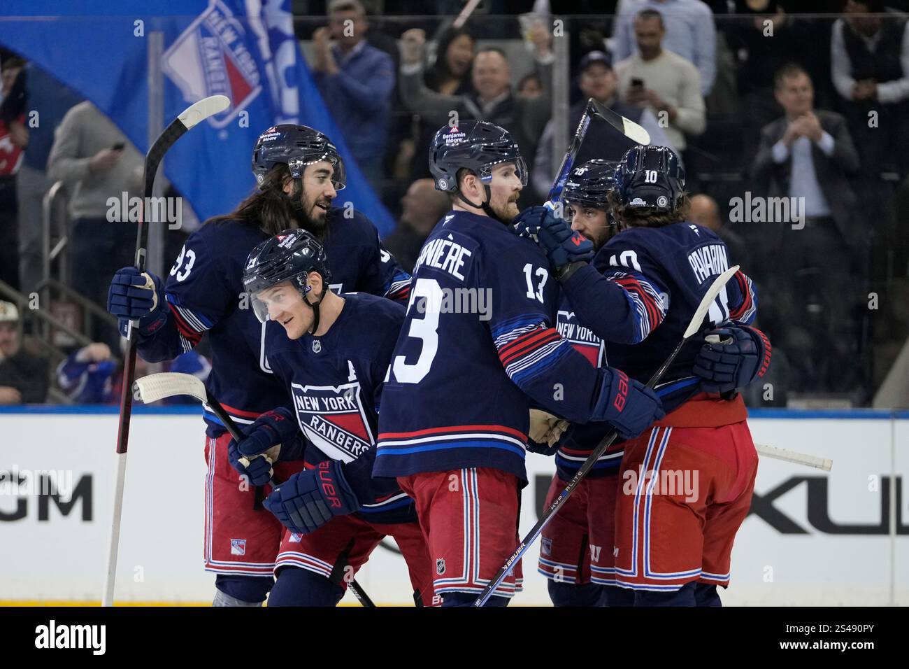 New York Rangers' Adam Fox, second from left, celebrates with teammates ...