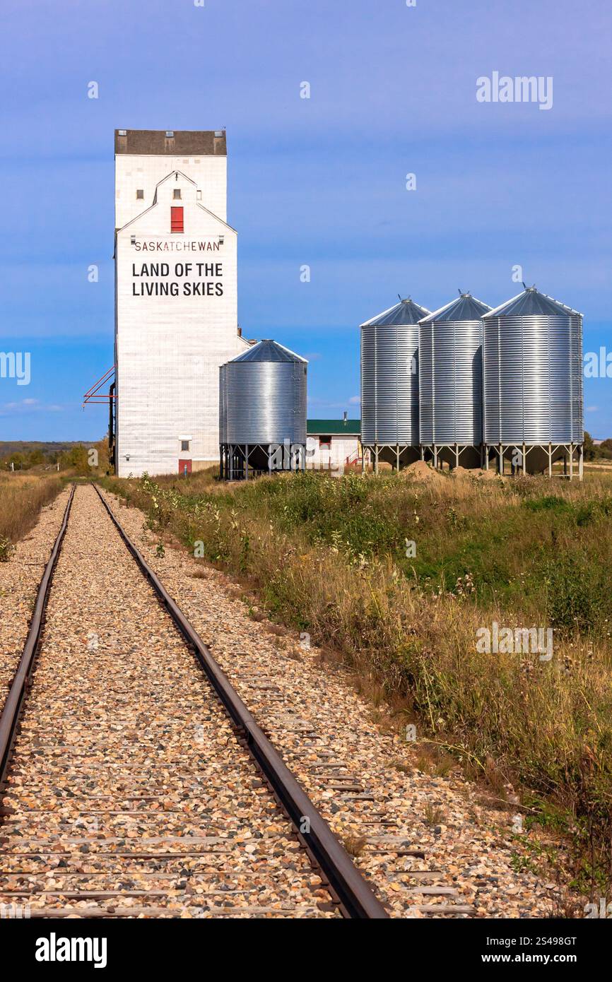 Train tracks with a grain silo in the background. The silo is labeled ...