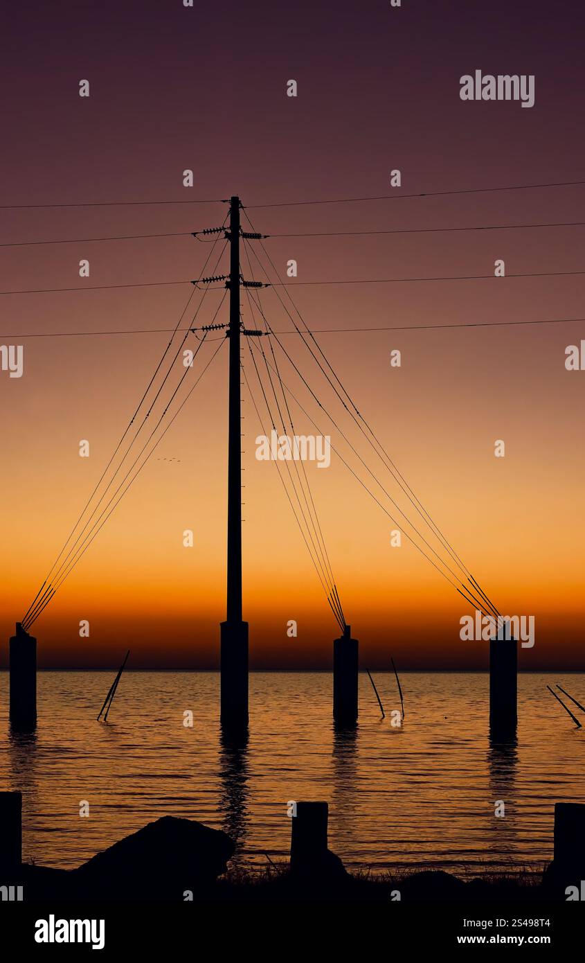 Power lines are pictured at sunset over Heron Bay, Jan. 3, 2025, in ...
