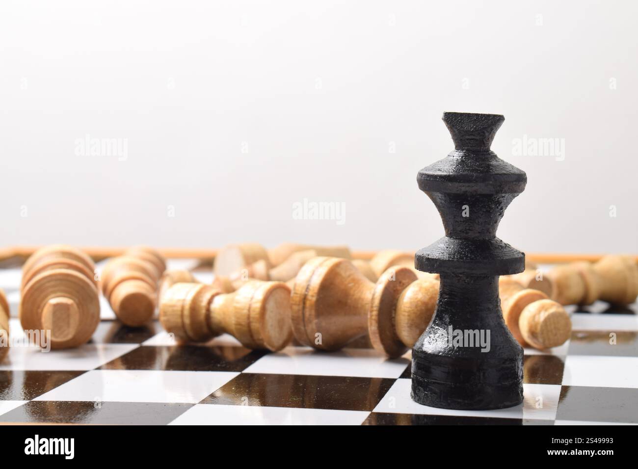 The black chess king defeated the white pieces. Business leader concept ...