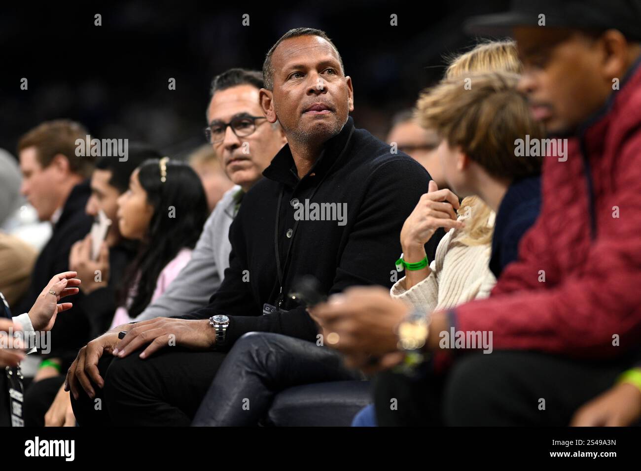 Minnesota Timberwolves minority owner Alex Rodriguez, center, looks on ...